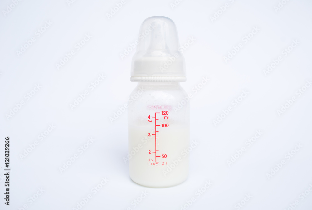 Baby bottle with milk and a measuring scale on white background Stock ...