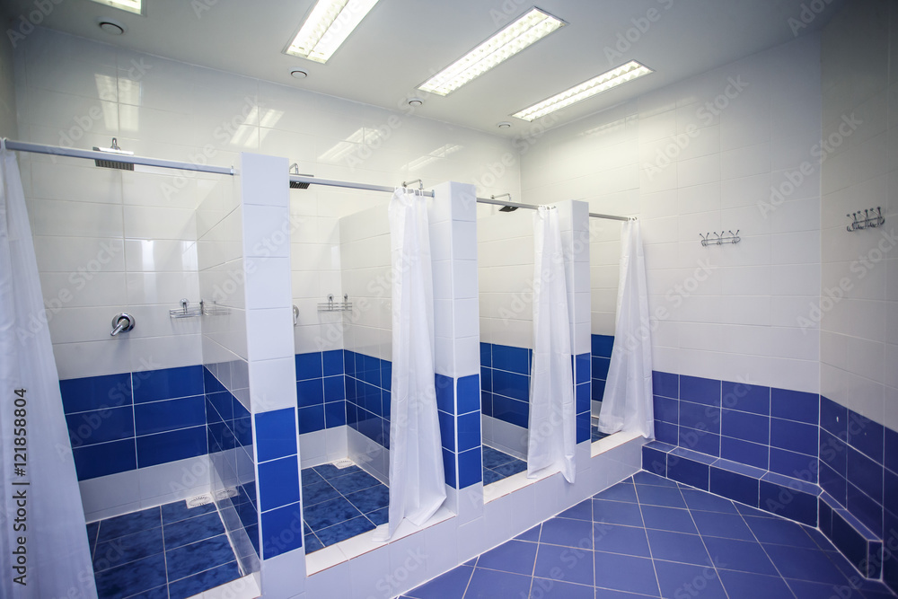 Shower room with cabins in a gym Stock Photo | Adobe Stock