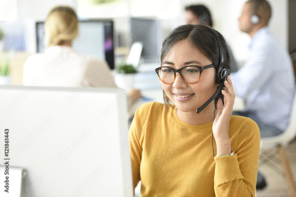 Customer service assistant working in office Stock Photo | Adobe Stock