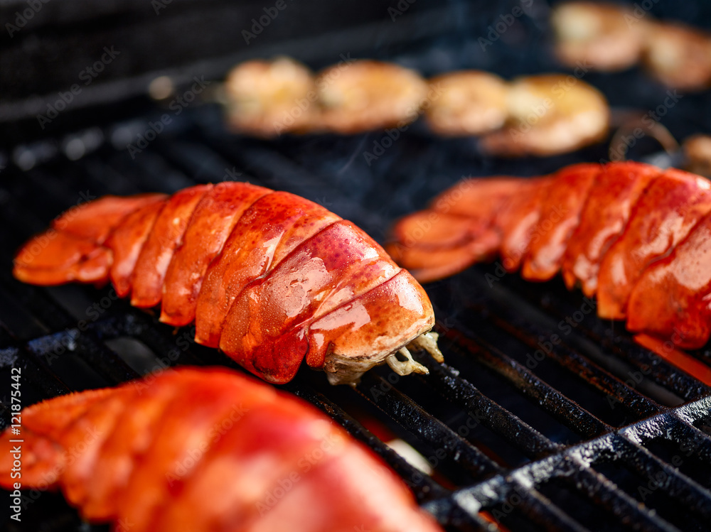 Lobster tails cooking on grill Stock Photo | Adobe Stock