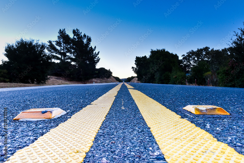 Double yellow line and reflective pavement markers Stock Photo | Adobe ...