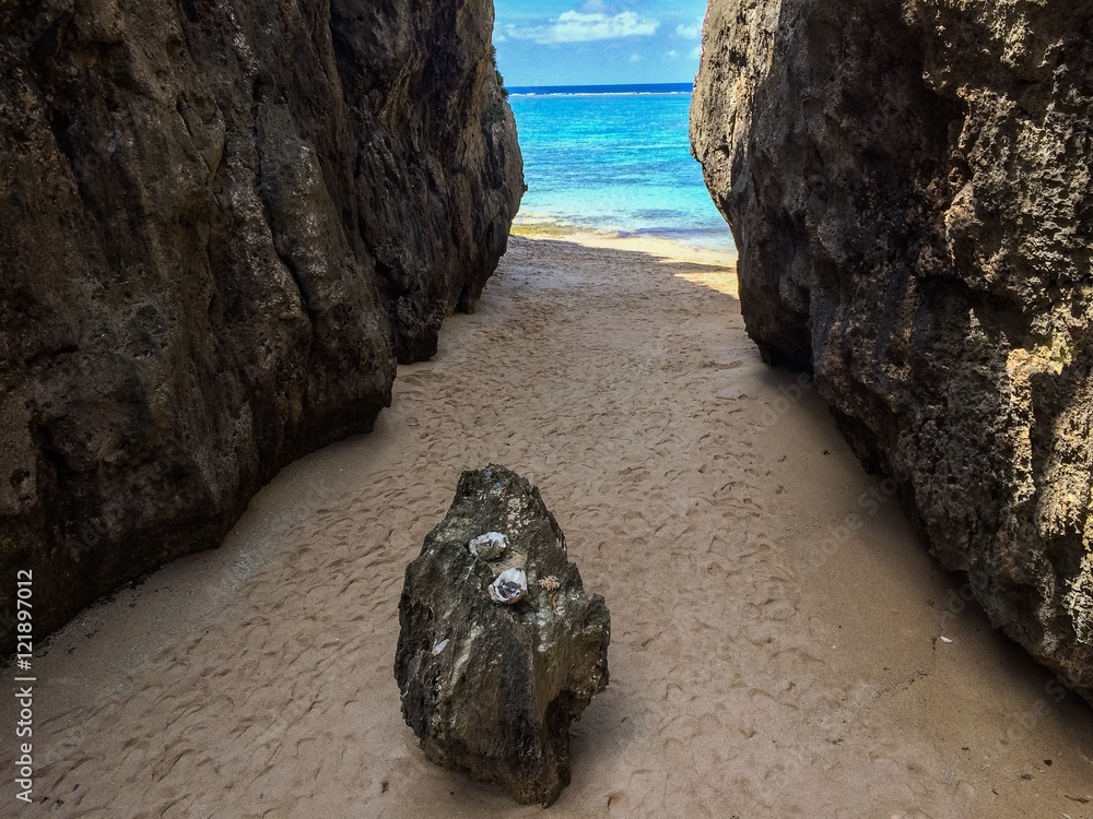 Road that leads to the sea between the rocks Stock Photo | Adobe Stock