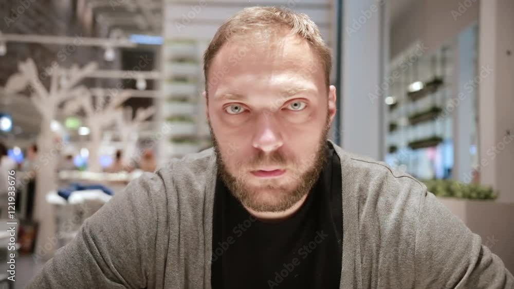 Serious man looking in camera. Funny man making silly face. Smiling man ...