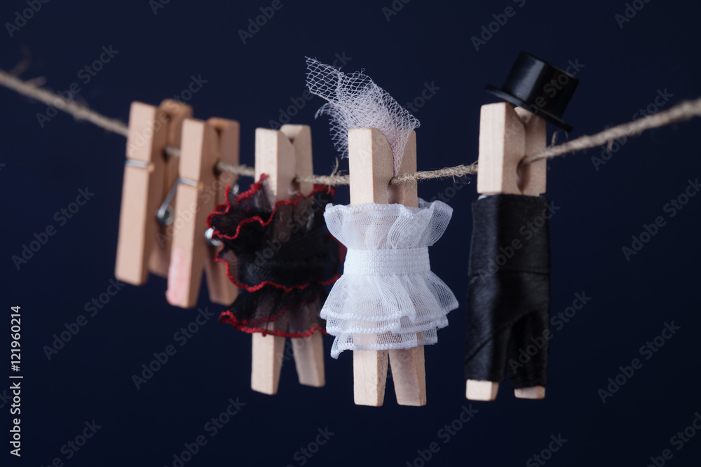 Clothespin characters on dark blue background. Woman in white black ...