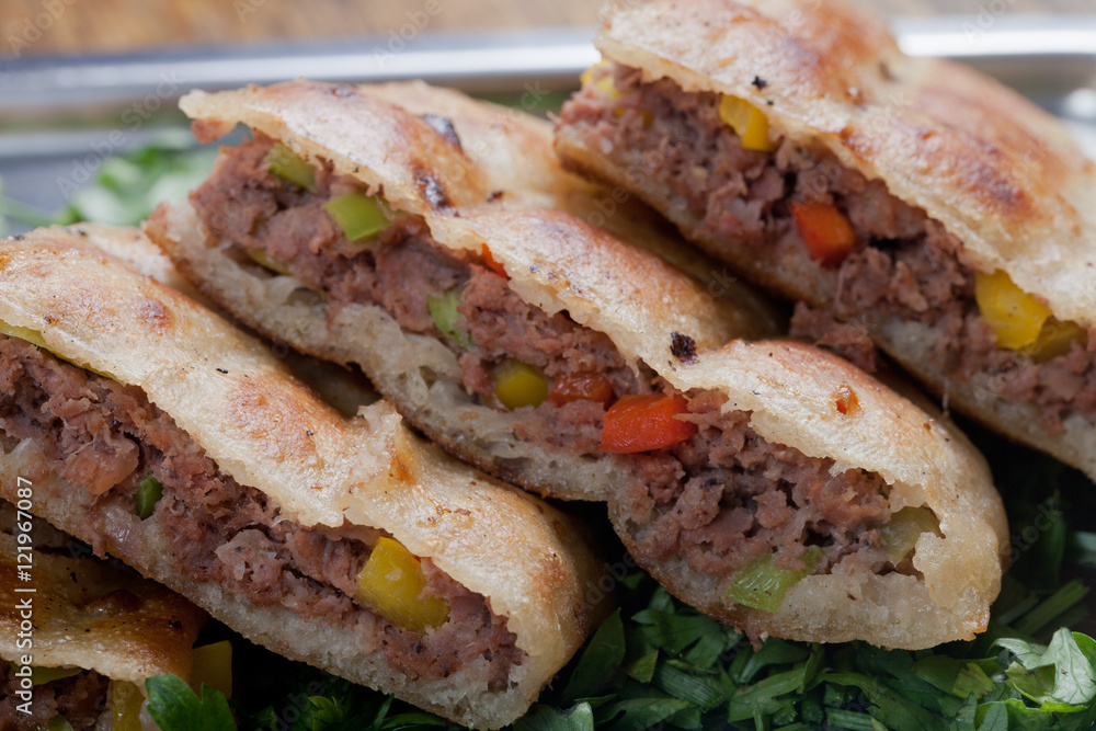 An Egyptian food hawawshi is a classic of spiced meat baked in bread ...