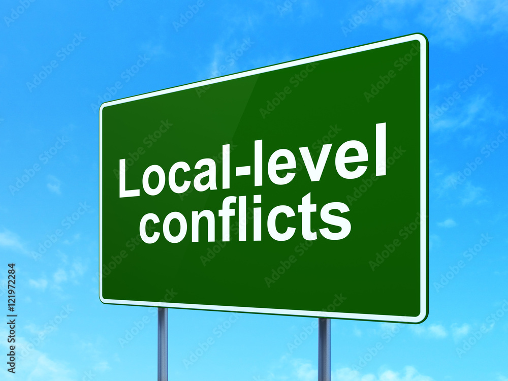 Politics concept: Local-level Conflicts on road sign background Stock ...