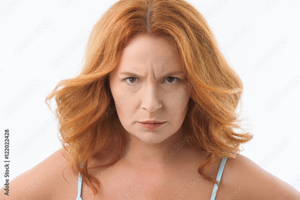 Mad mature lady staring at someone Stock Photo | Adobe Stock