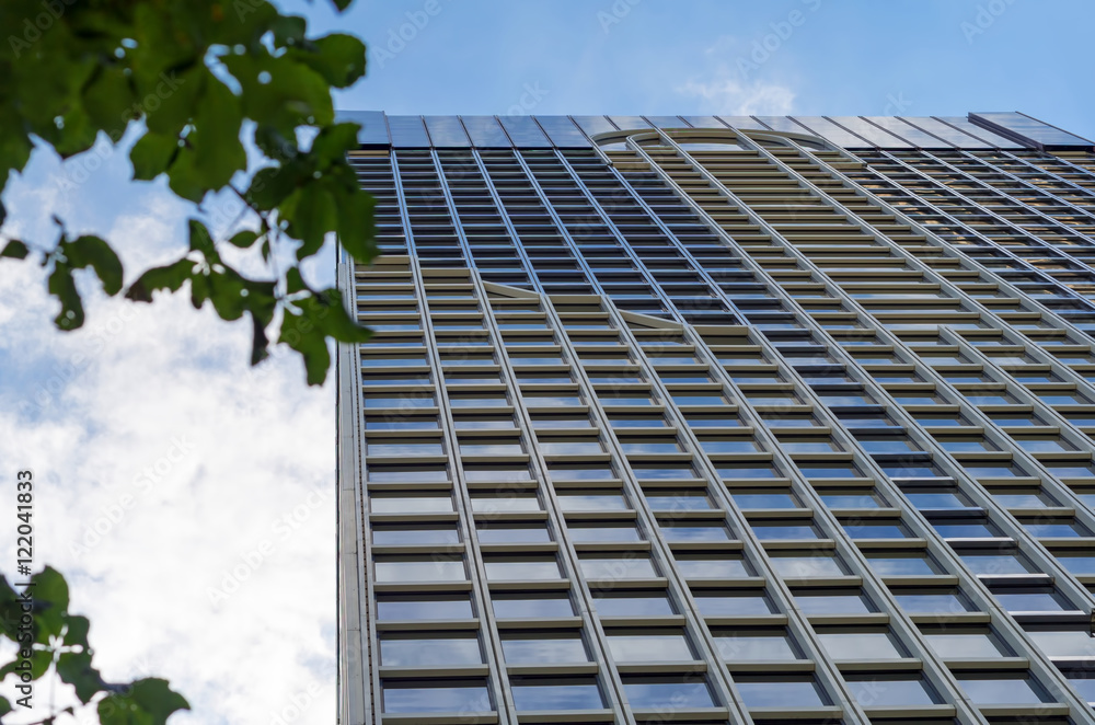 Modern urban architecture – glass side of an office building in the ...
