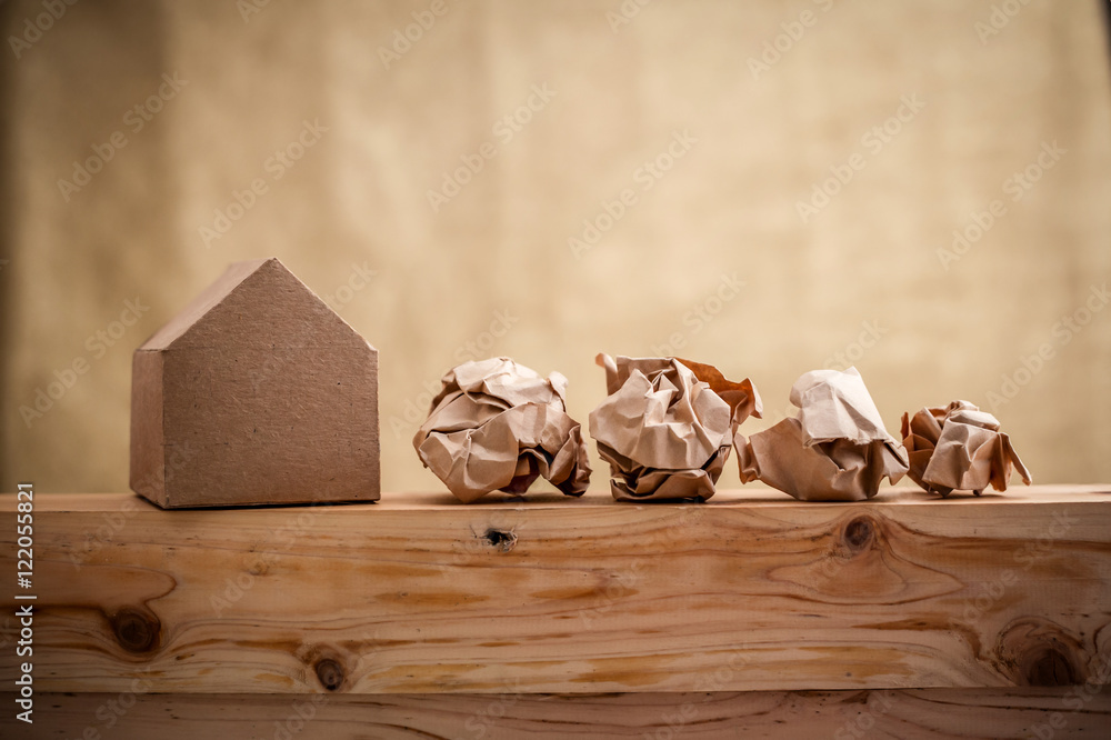 model of paper house building with trash paper balls Stock Photo ...