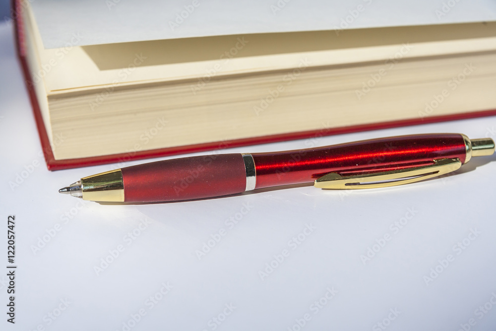 Open Book and Ballpoint Pen Stock Photo | Adobe Stock
