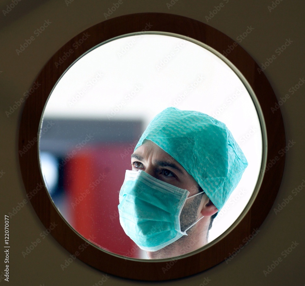 Reflection of doctor in mirror Stock Photo | Adobe Stock
