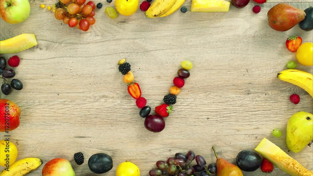 Fruits made letter V. Fruits are forming letters. The composition of ...