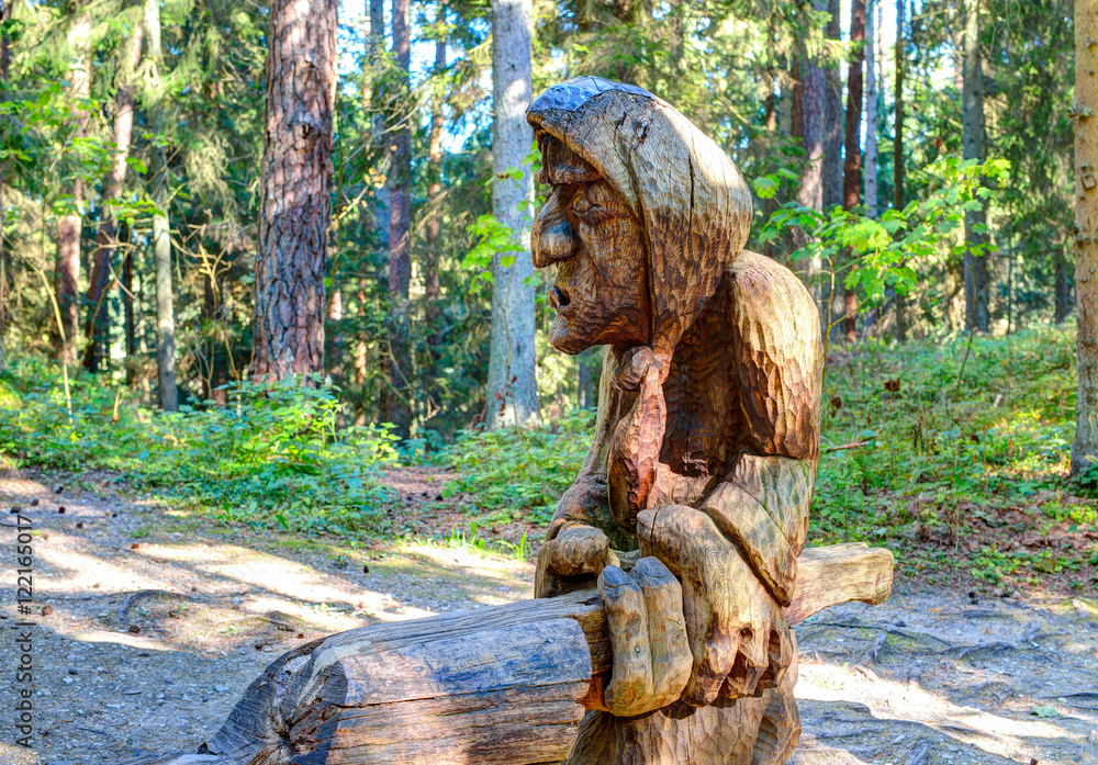 Old wooden sculptures in the forest. Witch Hill park, Lithuania. Stock ...