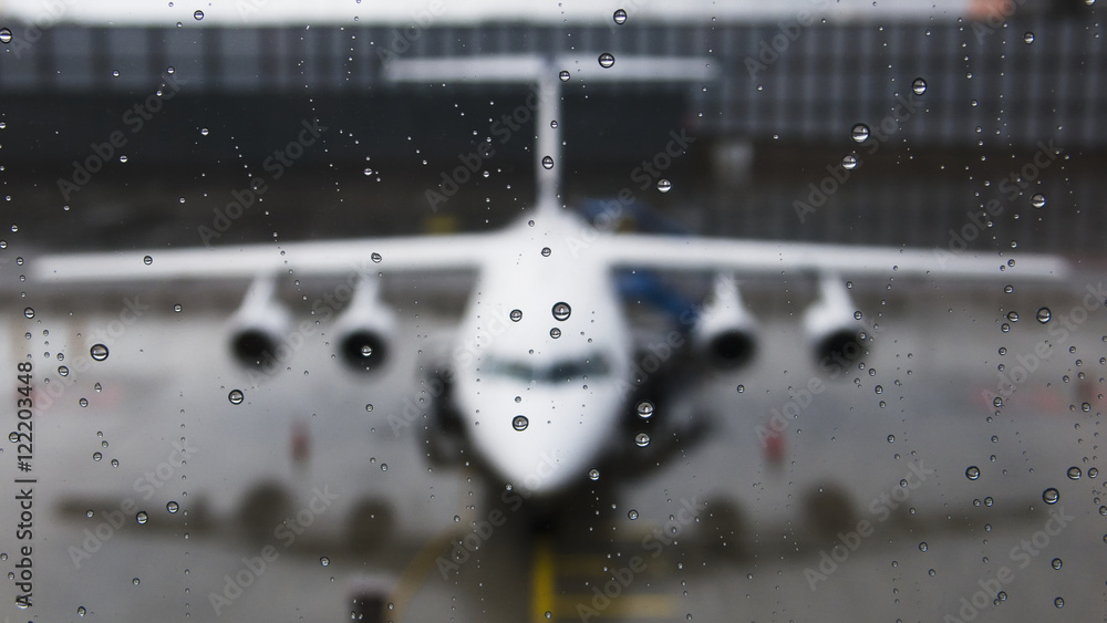 View of the front of an aircraft through a wet window; Munich, Germany ...