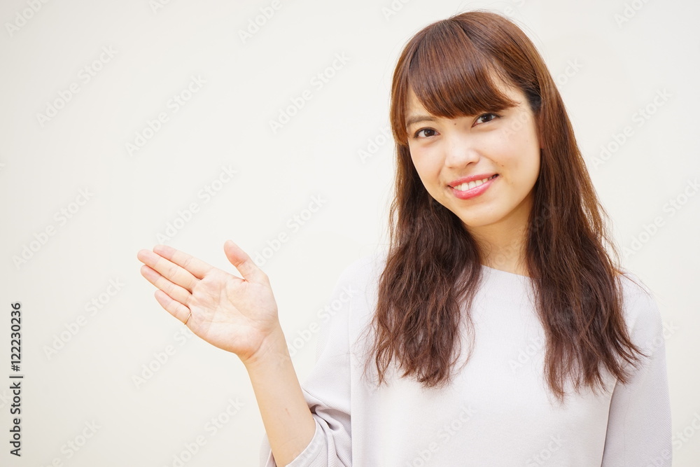 Young Japanese woman pointing something with smile Stock Photo | Adobe ...