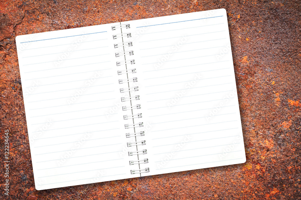 Open notebook paper page with line on rusty metal background for design ...