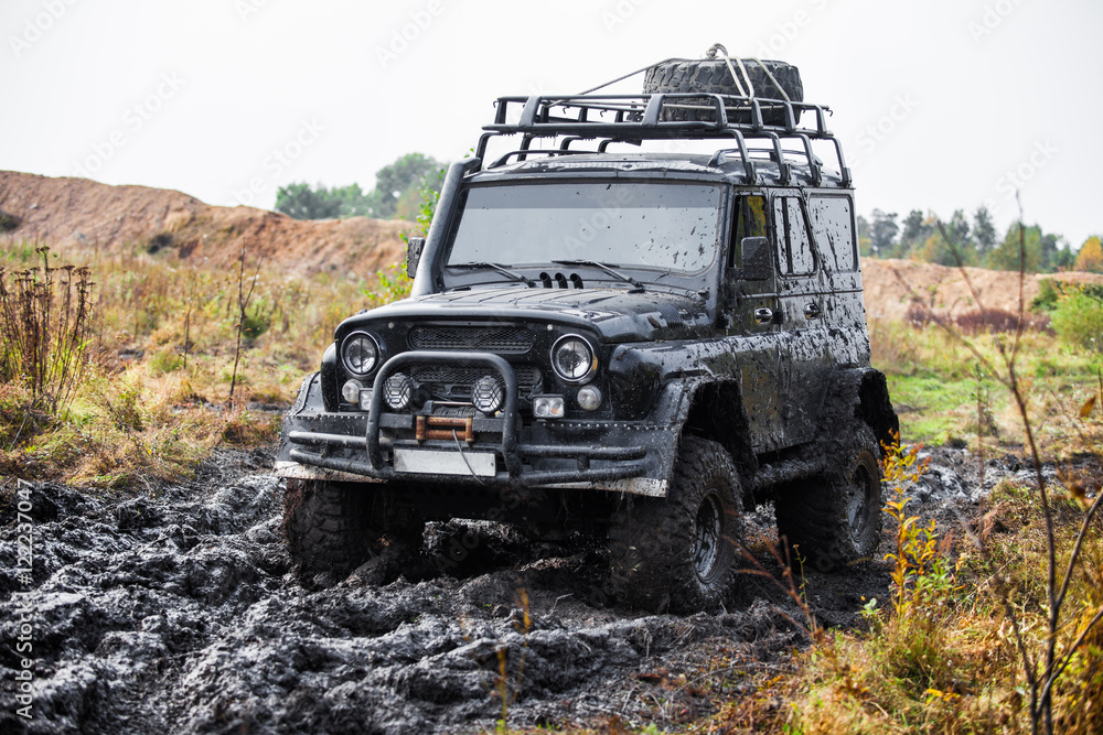 Russian black off road car UAZ in mud Stock Photo | Adobe Stock