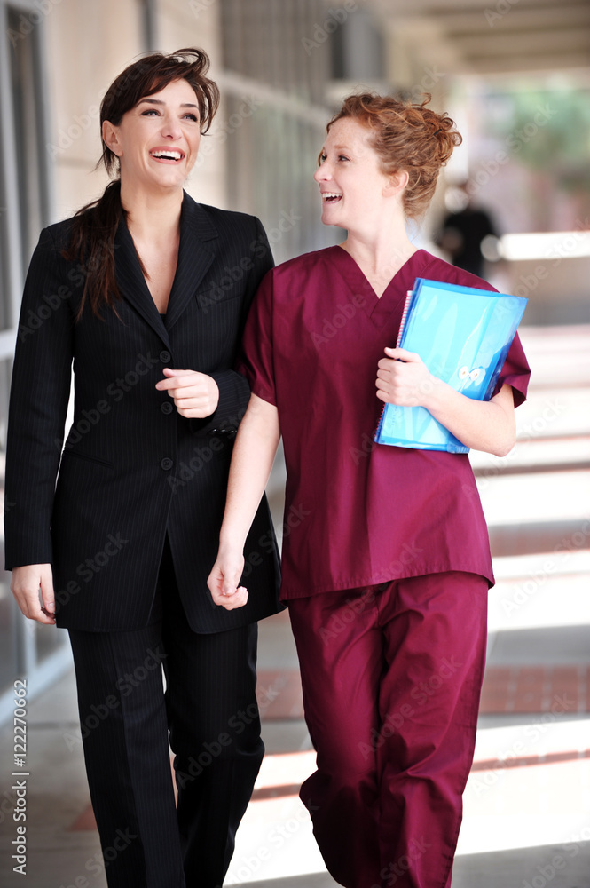Female administrator pharmaceutical rep doctor nurse therapist walking ...