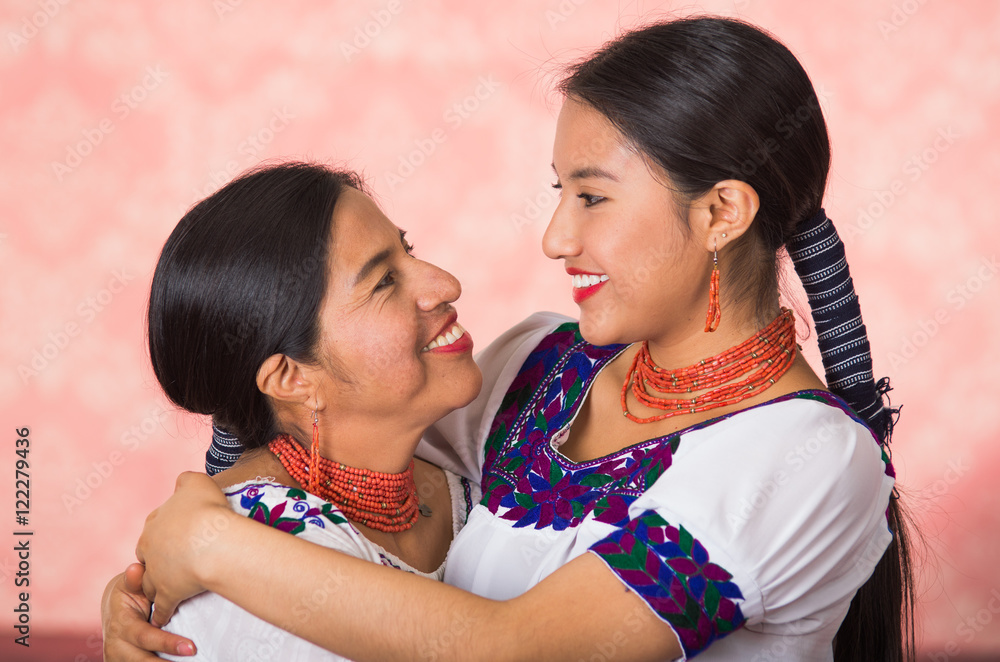 Beautiful hispanic mother and daughter wearing traditional andean ...
