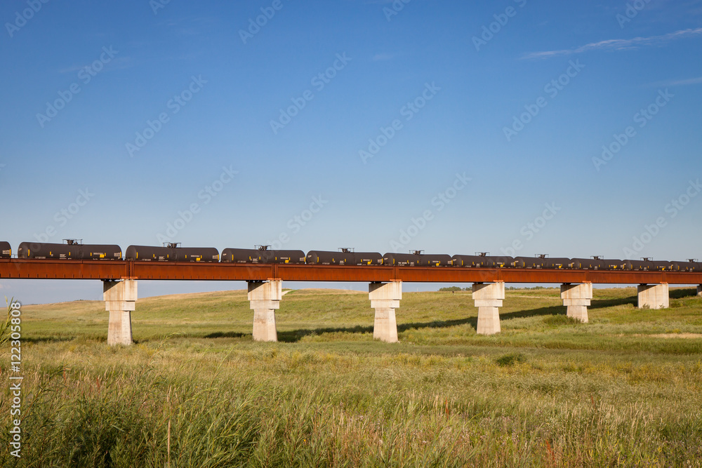 Train of Black Tank Cars Crossing a Rusty Bridge Stock Photo | Adobe Stock
