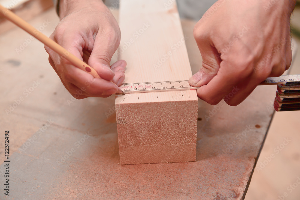 Exakt measurement with two hands and a folding rule Stock Photo | Adobe ...