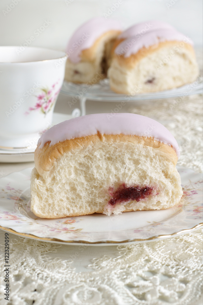 Iced buns or fingers a brioche style bun covered with pink icing Stock ...