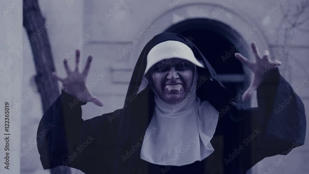 zombie nun. devilish woman in nun costume walking around the temple ...