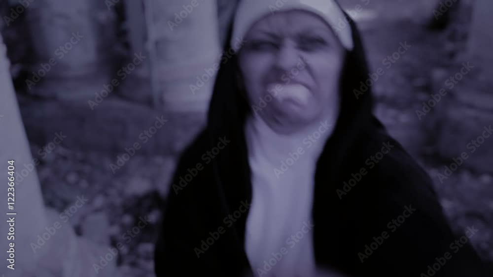zombie nun. devilish woman in nun costume walking around the temple ...