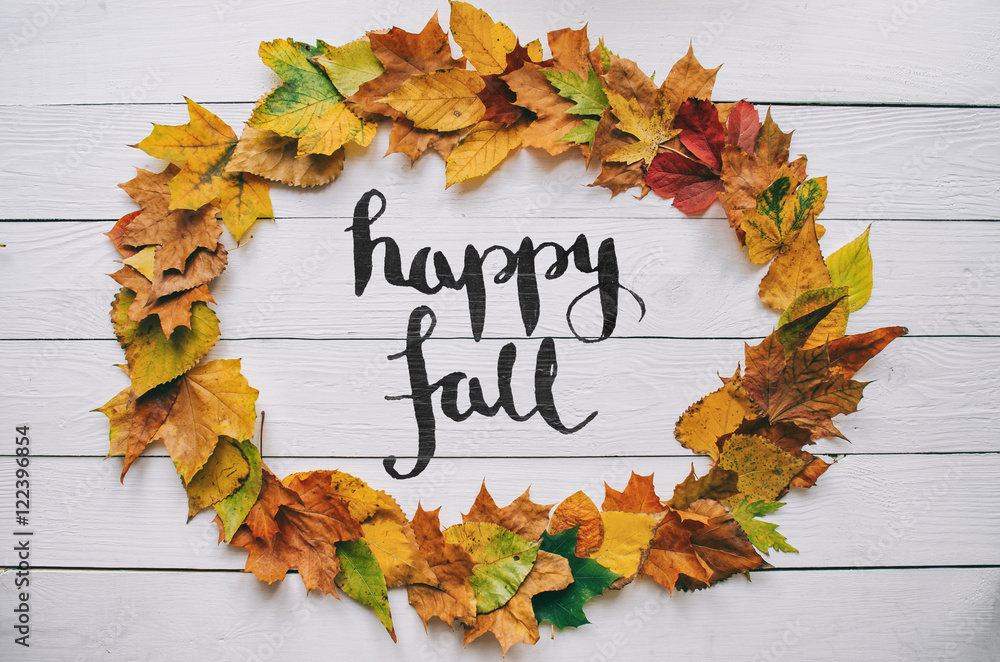 Happy fall handwritten modern calligraphy on colorful autumn dry leaves ...