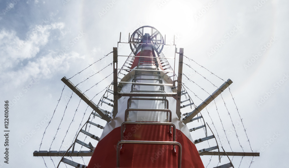 Newly completed telecommunication tower or monopole with white and red ...