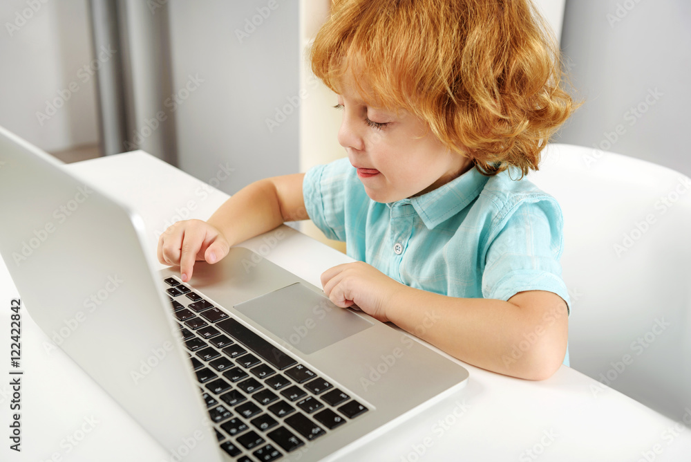 cute little developer studying with pc Stock-Foto | Adobe Stock