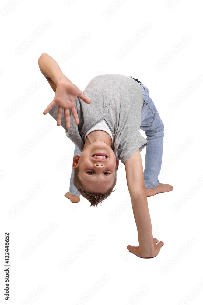 Teenage boy standing in a gymnastic bridge pose with a welcome gesture ...