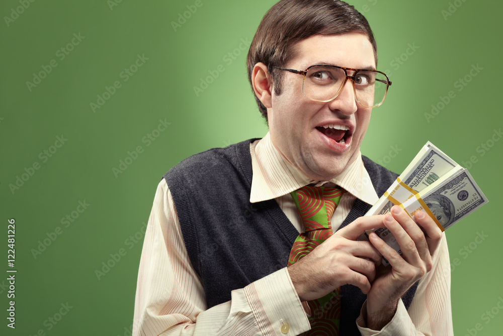 Portrait of a happy nerd counting his money Stock Photo | Adobe Stock