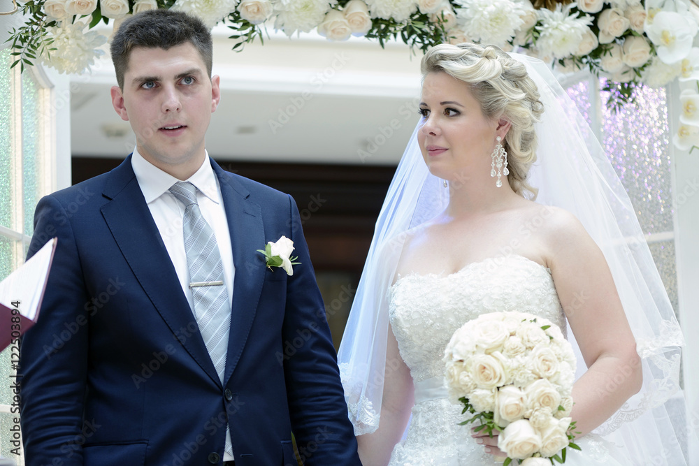 Beauty bride and handsome groom are registering the marriage. Wedding ...