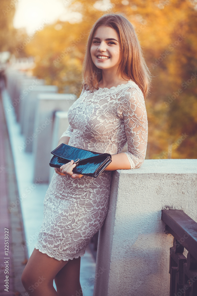 Portrait of beautiful young girl in beige dress. Fashion photo Stock ...