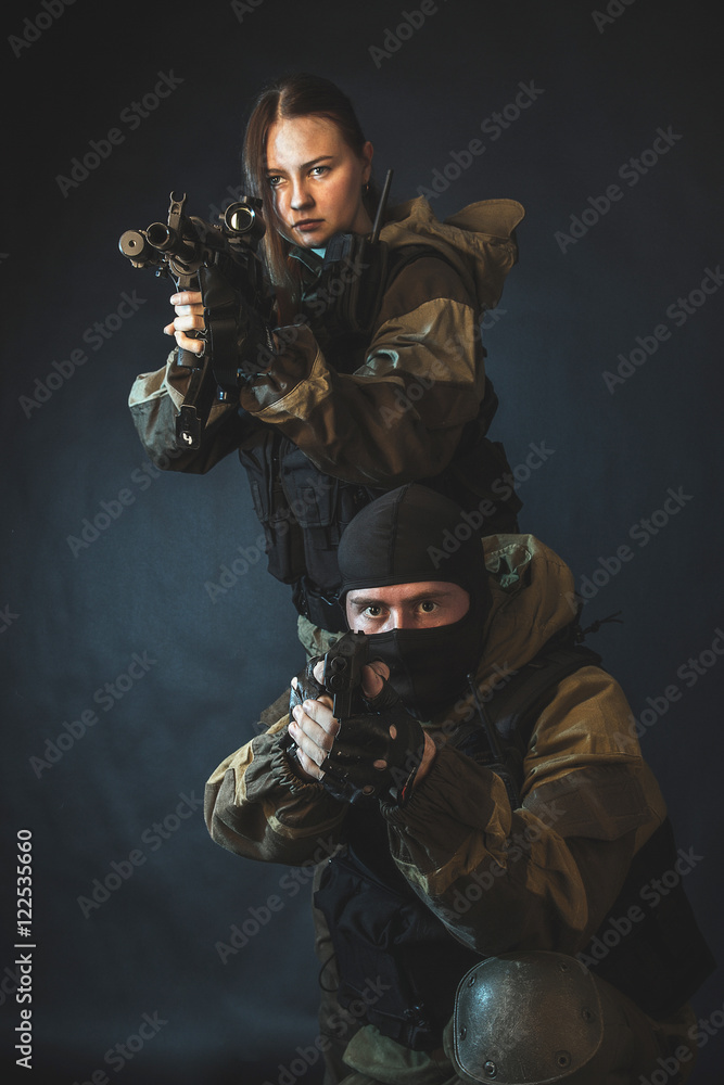 Man and woman in the images of a members of the special forces division ...