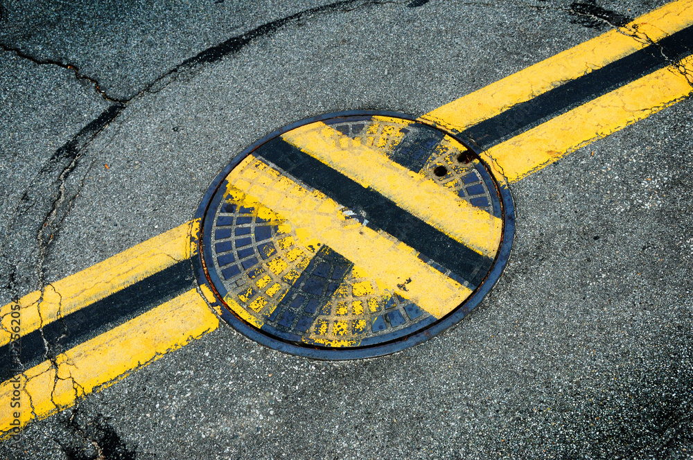 Misaligned manhole cover Stock Photo | Adobe Stock