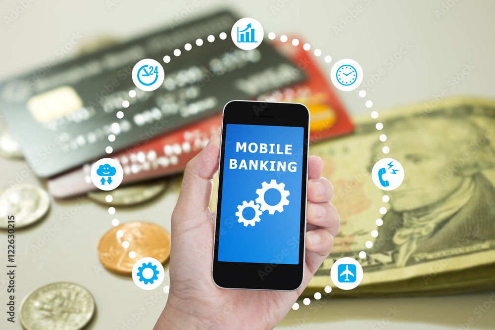 Hand holding mobile phone with Mobile banking application on blurred ...