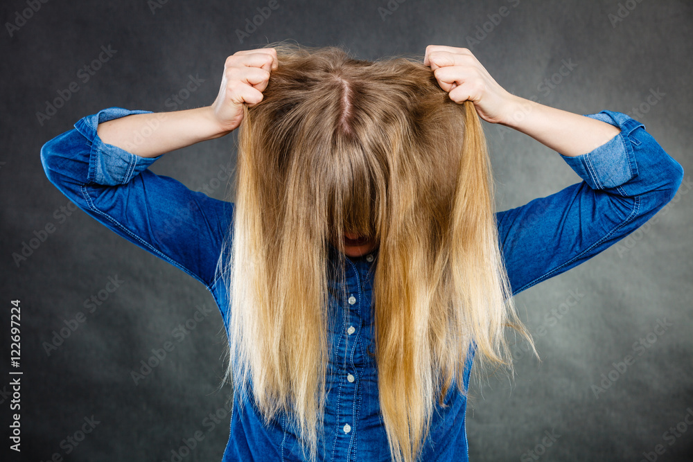Furious woman pull hair out of head. Stock Photo | Adobe Stock