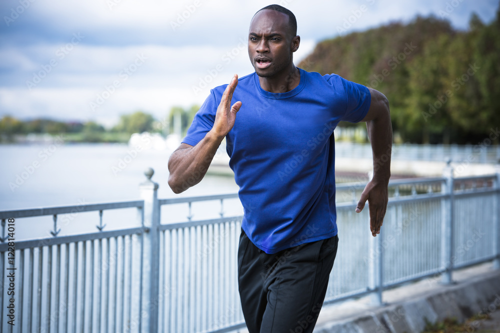 young man running outdoors Stock Photo | Adobe Stock