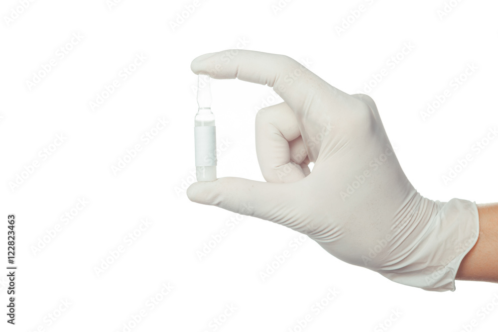 doctor's hand in white sterilized surgical glove holding medicine Stock ...