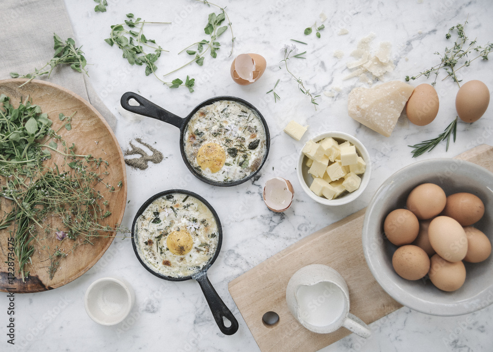 Overhead view of a table with food in dishes. Stock Photo | Adobe Stock