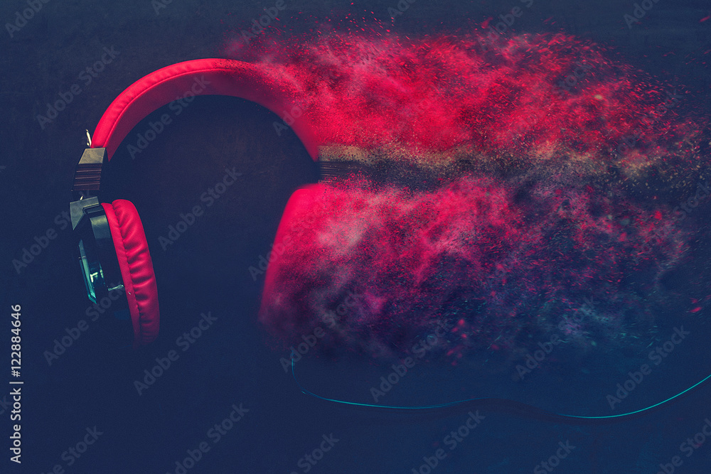 Disintegration effect photo manipulation applied to red headphones ...