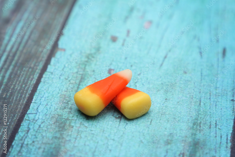 Candy Corn Isolated on a Blue Wooden Surface Stock Photo | Adobe Stock