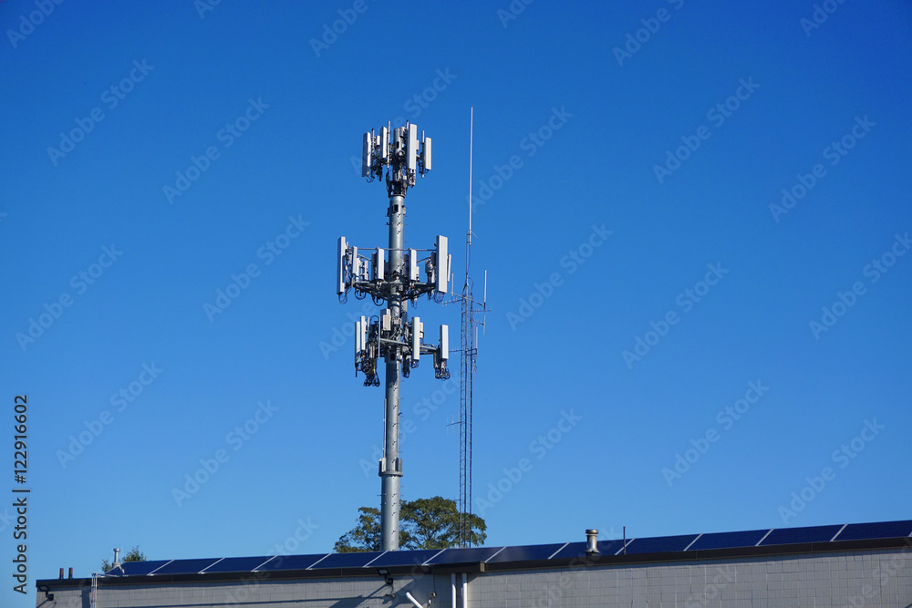 communication antenna tower with solar panels Stock Photo | Adobe Stock