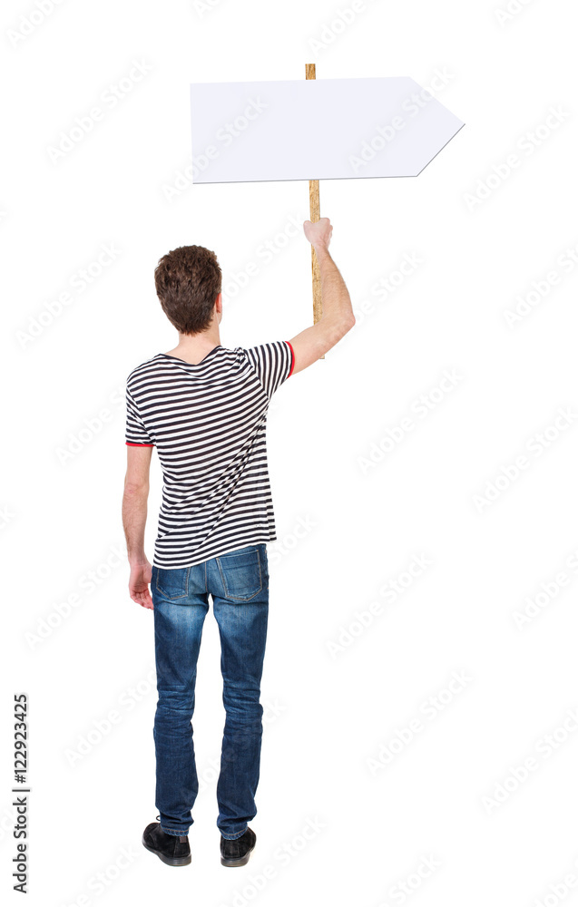 Back view man showing sign board. man holds information plate. Rear ...