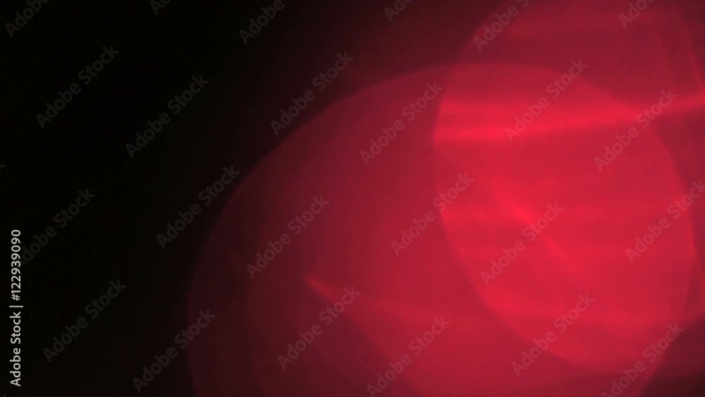 Subtle light leak on black background, moving red lens flare. Overlay ...