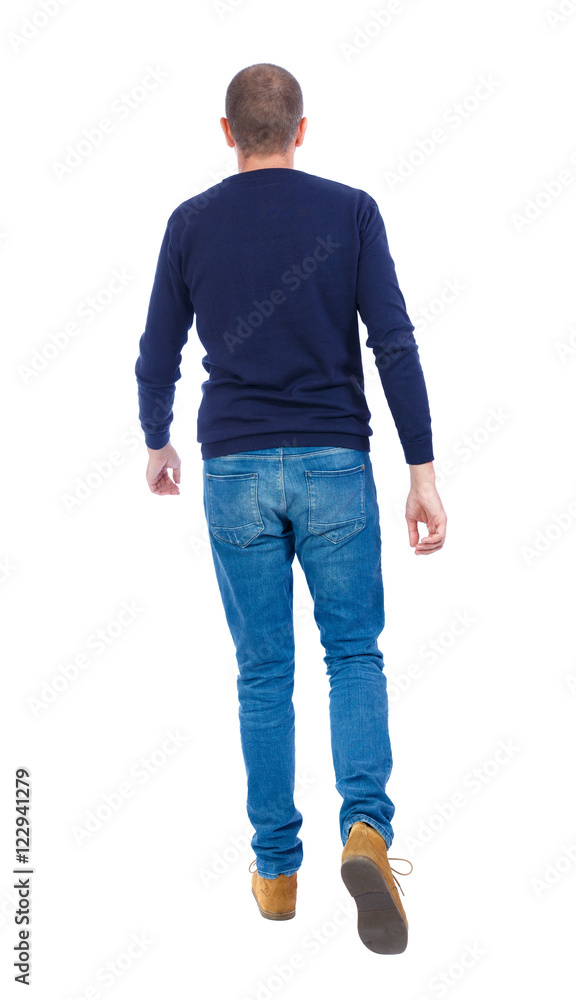 Back view of going handsome man. walking young guy . Rear view people ...