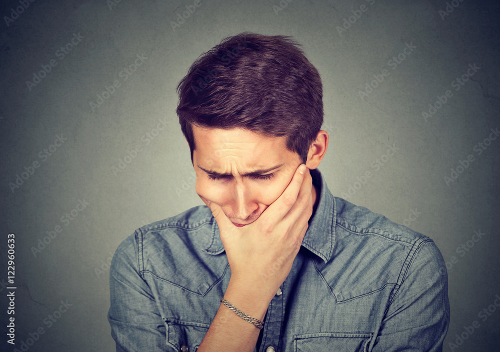 portrait stressed sad young man looking down Stock Photo | Adobe Stock
