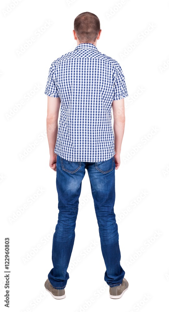 Back view of handsome man in shirt looking up. Standing young guy in ...